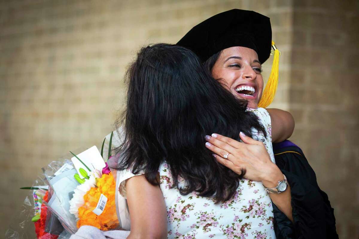 Law school grads finally get to don caps and gowns at graduation events
