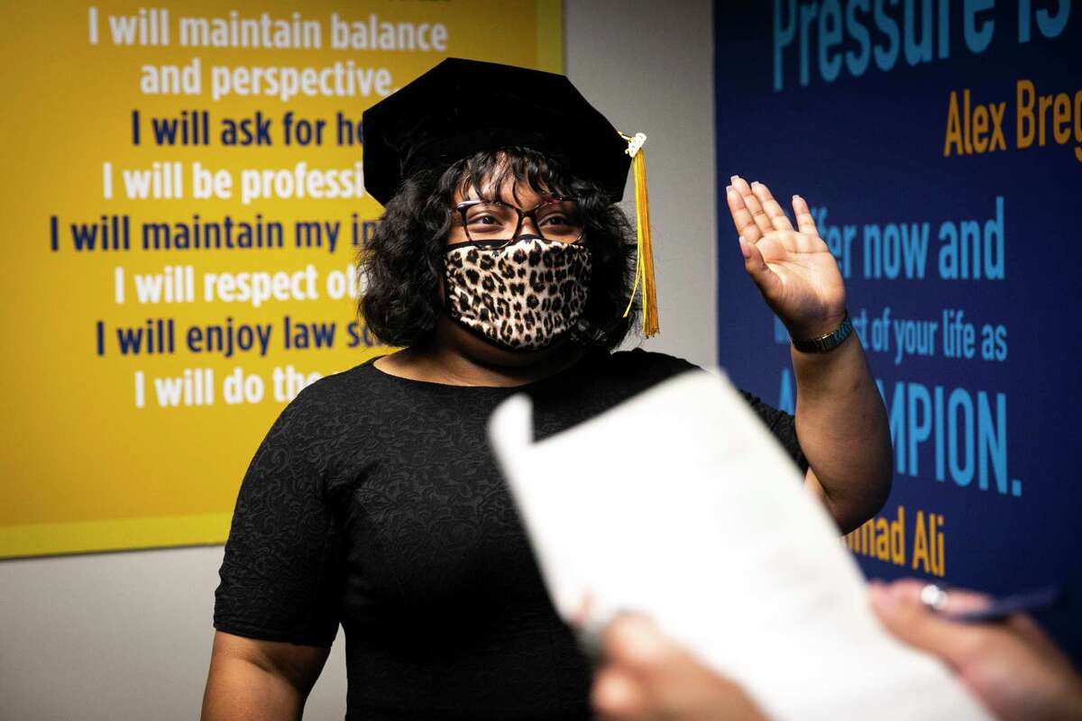 Law school grads finally get to don caps and gowns at graduation events
