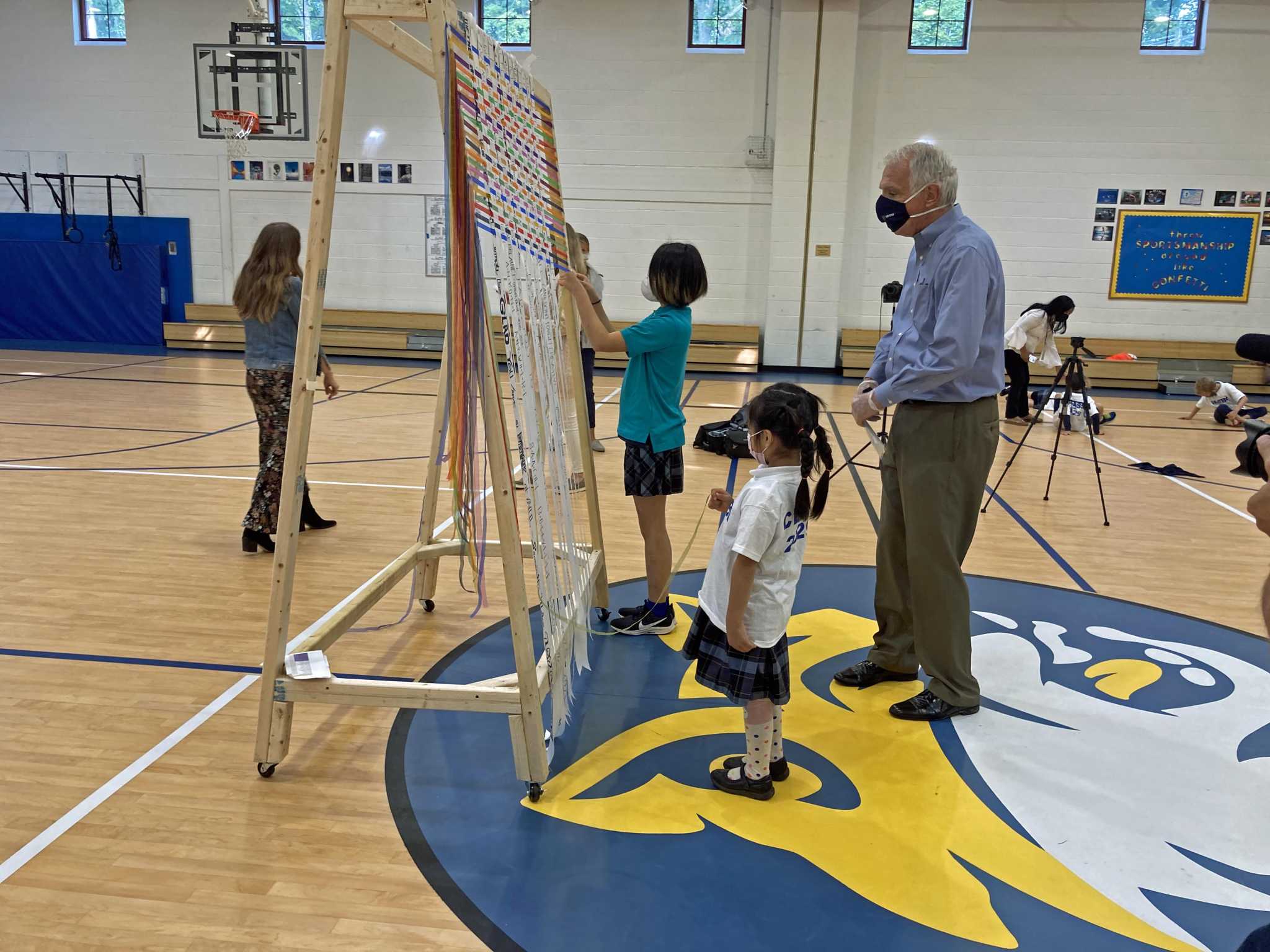 Greenwich students weave a social-distancing rule into an art form