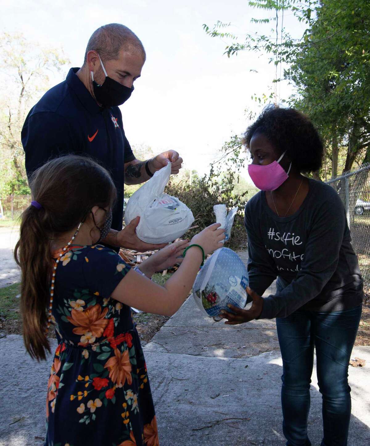 Two Houston families share thanks on a different kind of turkey giveaway