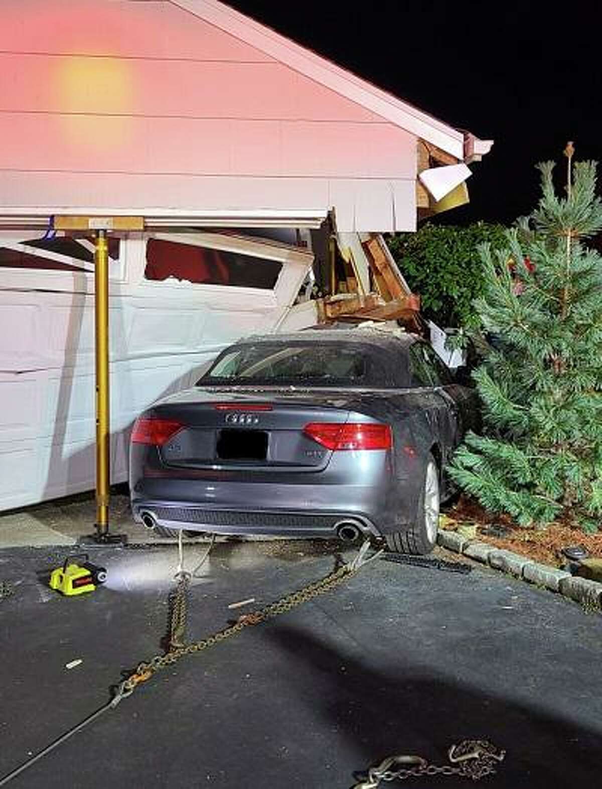 Fire official: Car crashes into garage in North Stamford