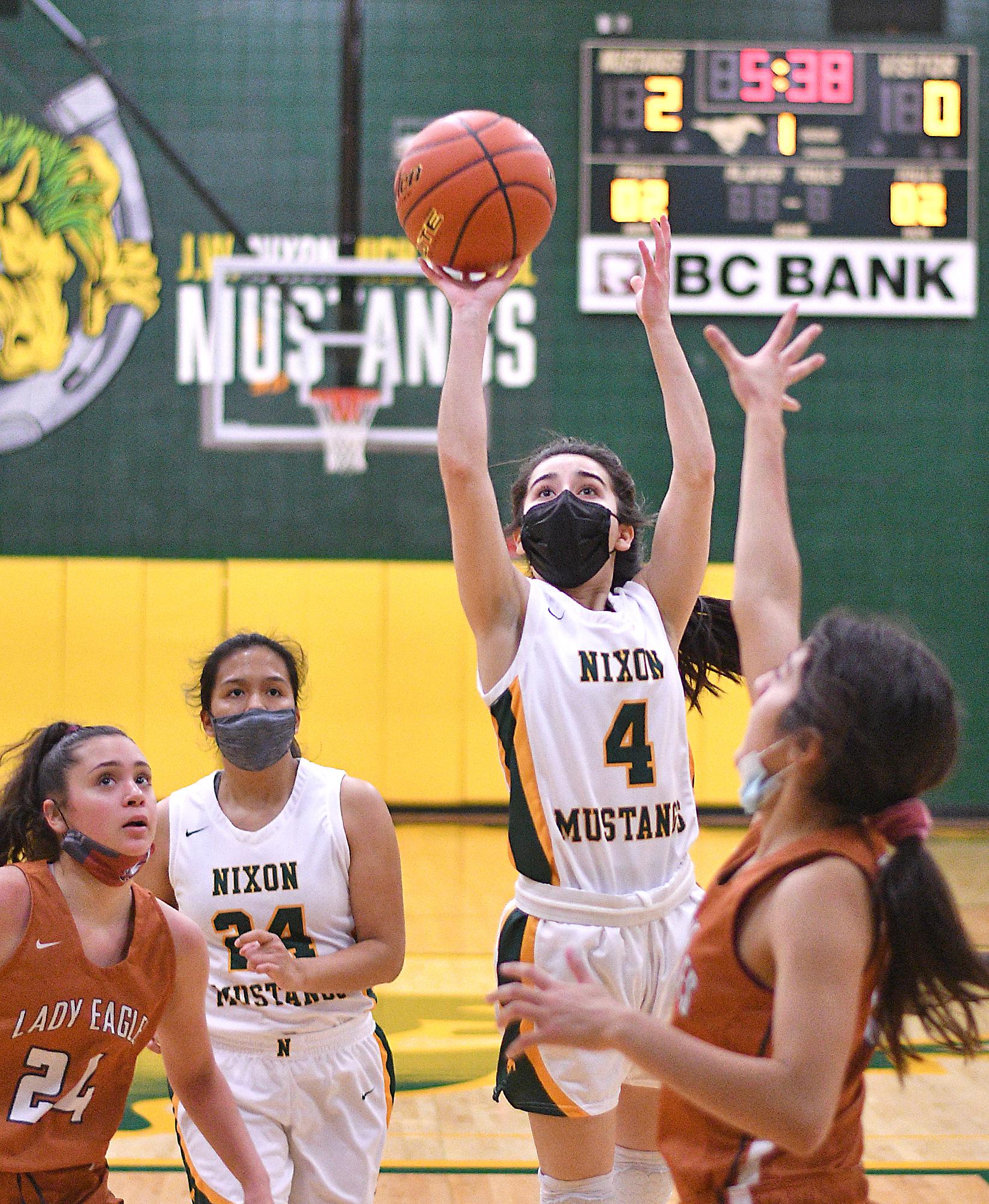 Lady Mustangs earn first district victory