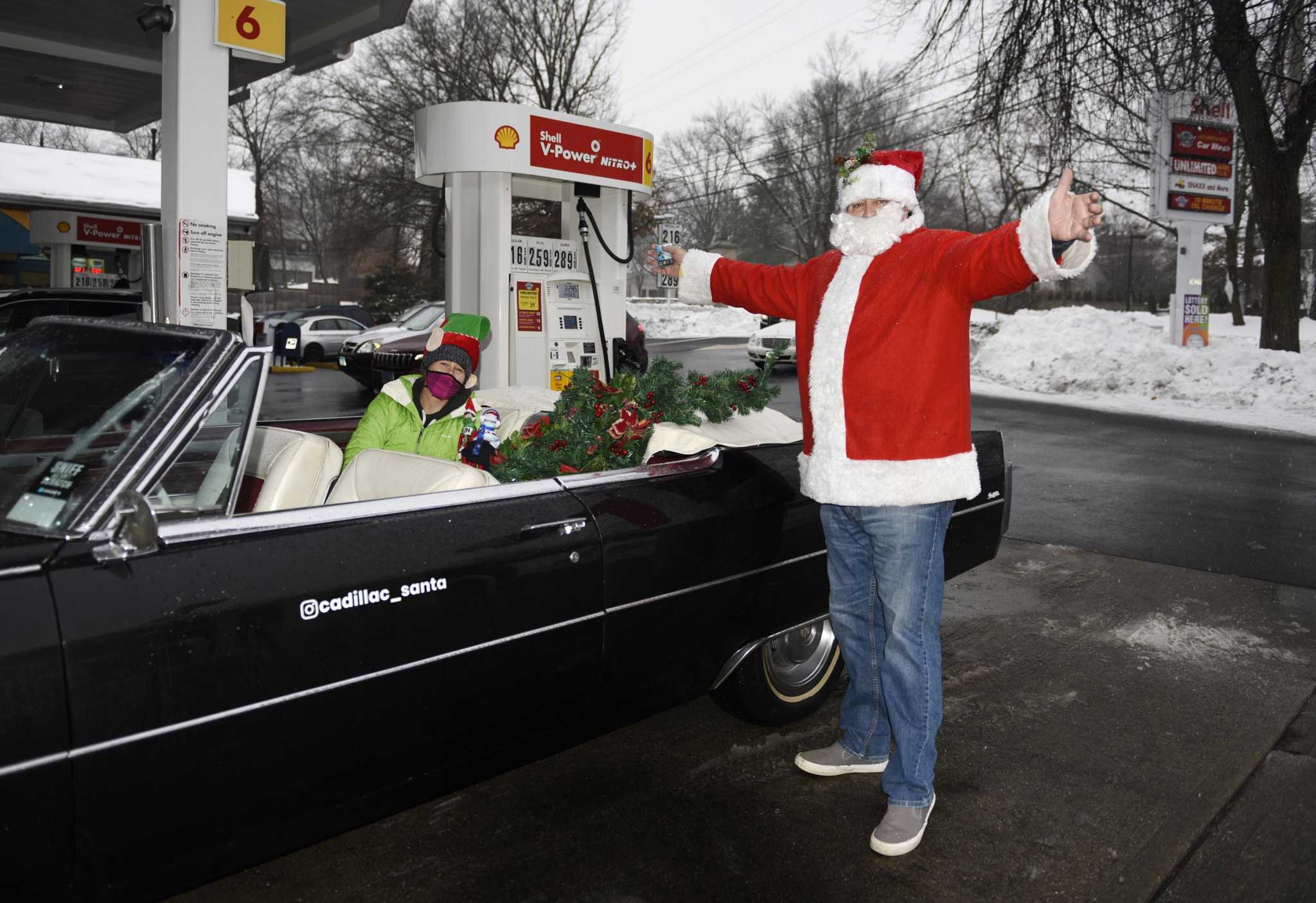 Santa cruises in a convertible in Greenwich