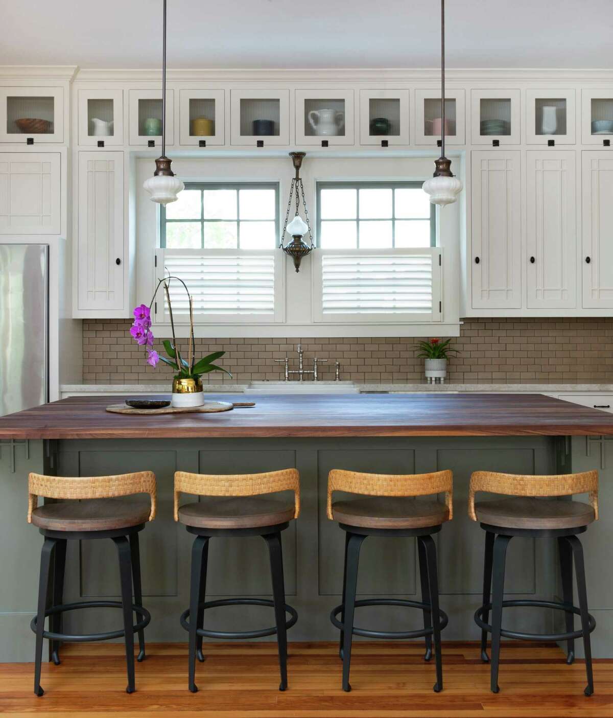 This couple built a modest home in the Heights with big porches
