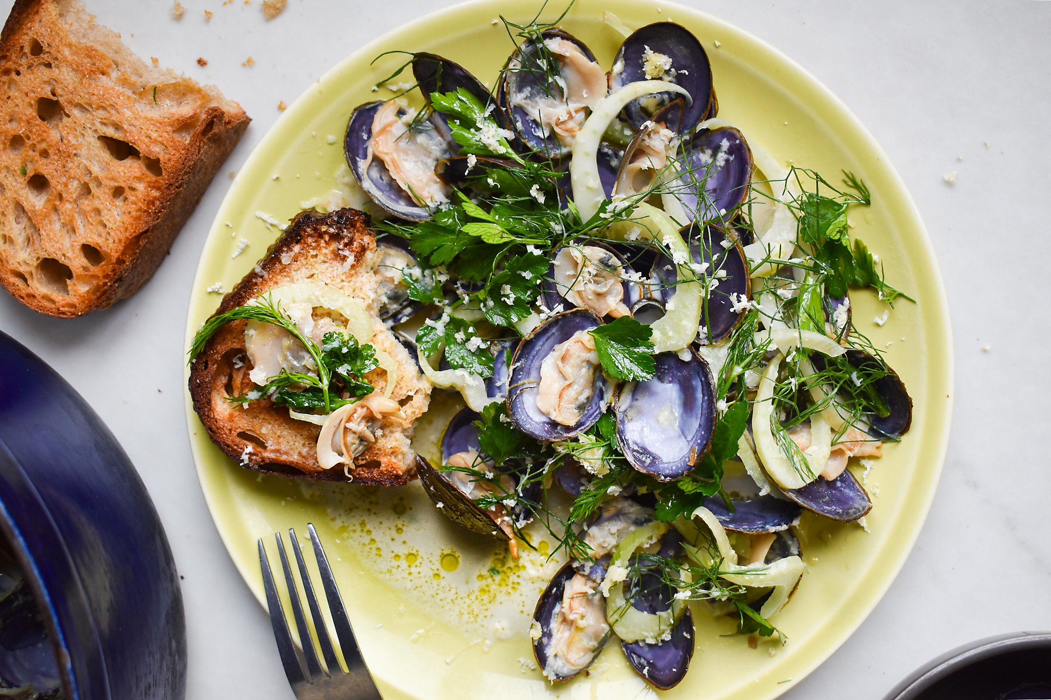 Briny clams get a kick from fresh horseradish and herbs