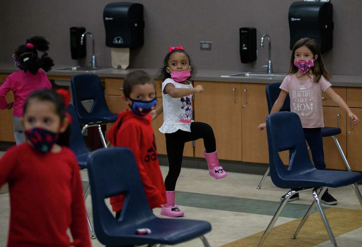 Despite COVID-19 surge, thousands of students return to Houston ...