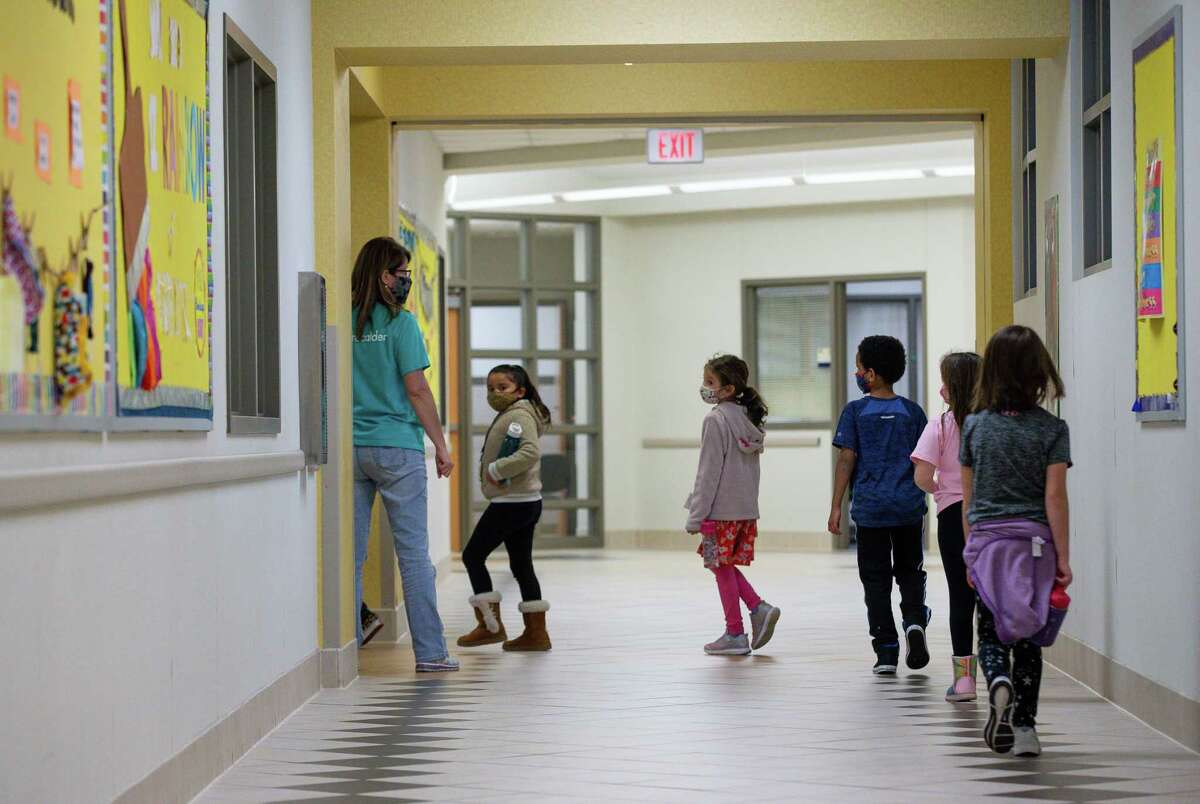 Despite COVID-19 surge, thousands of students return to Houston ...