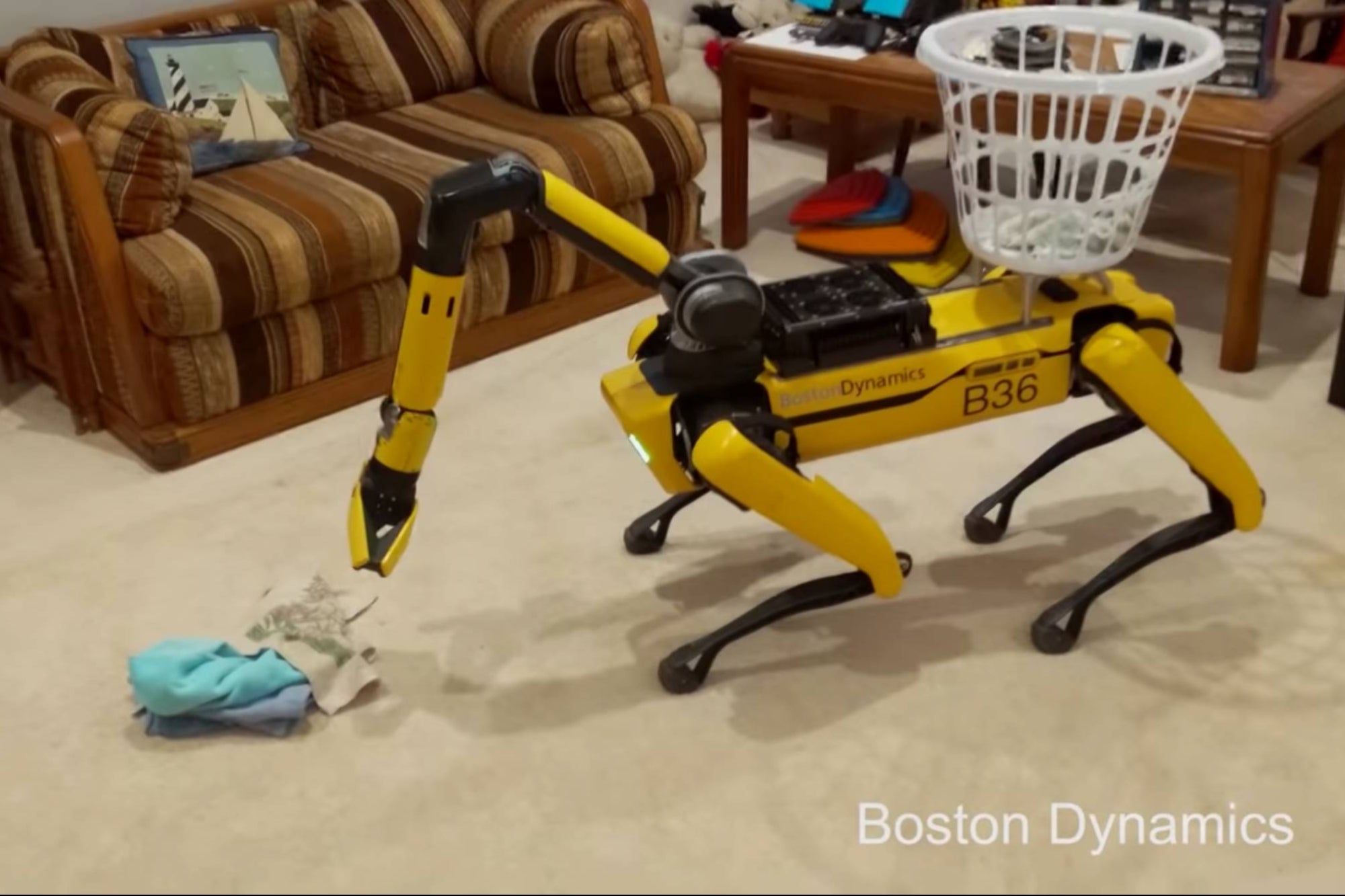 Boston Dynamics' Robotic Dog Now Has an Arm and Here's What It Can Do