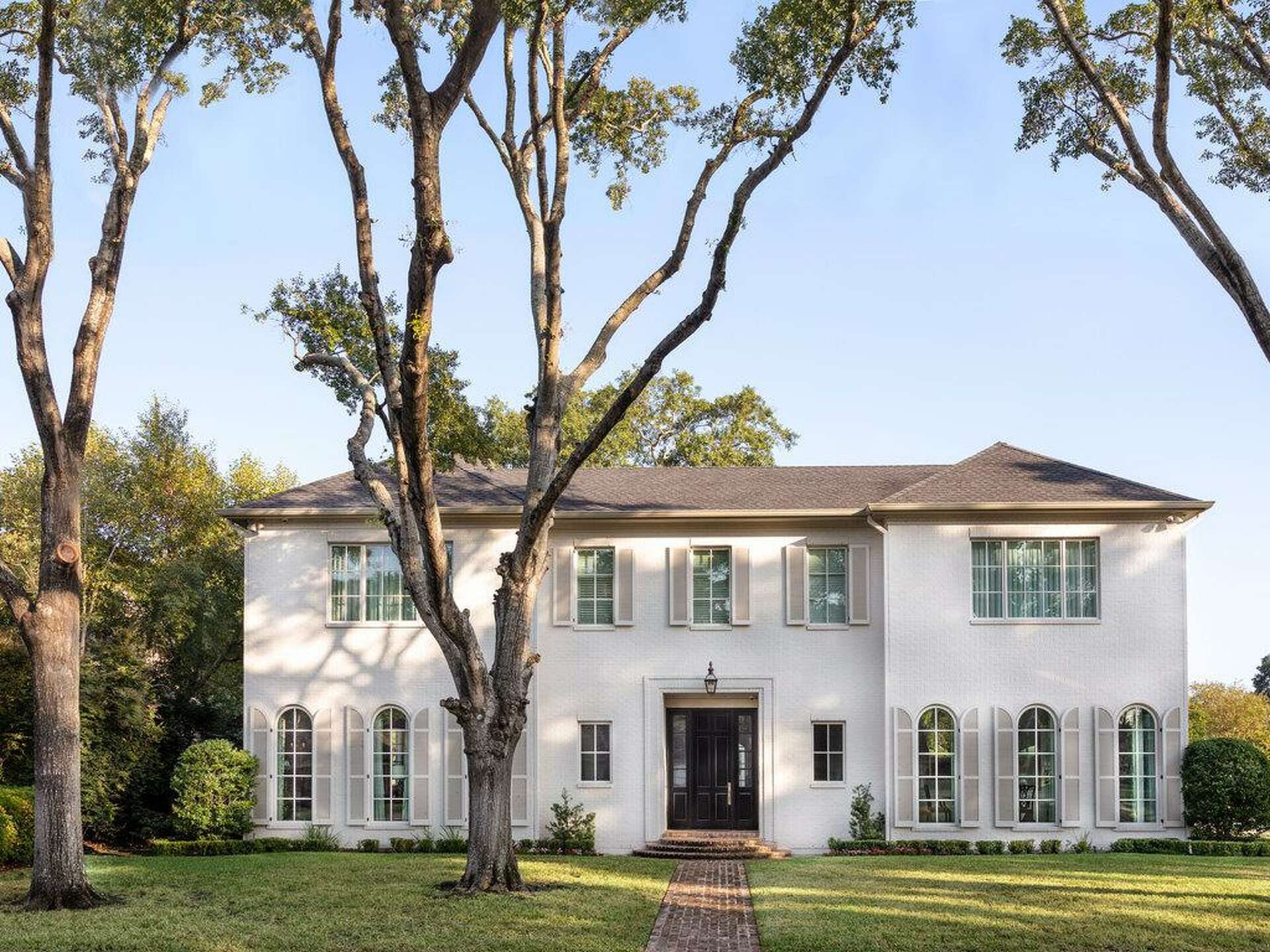 Painted white brick exterior with black trim is a popular trend in Houston