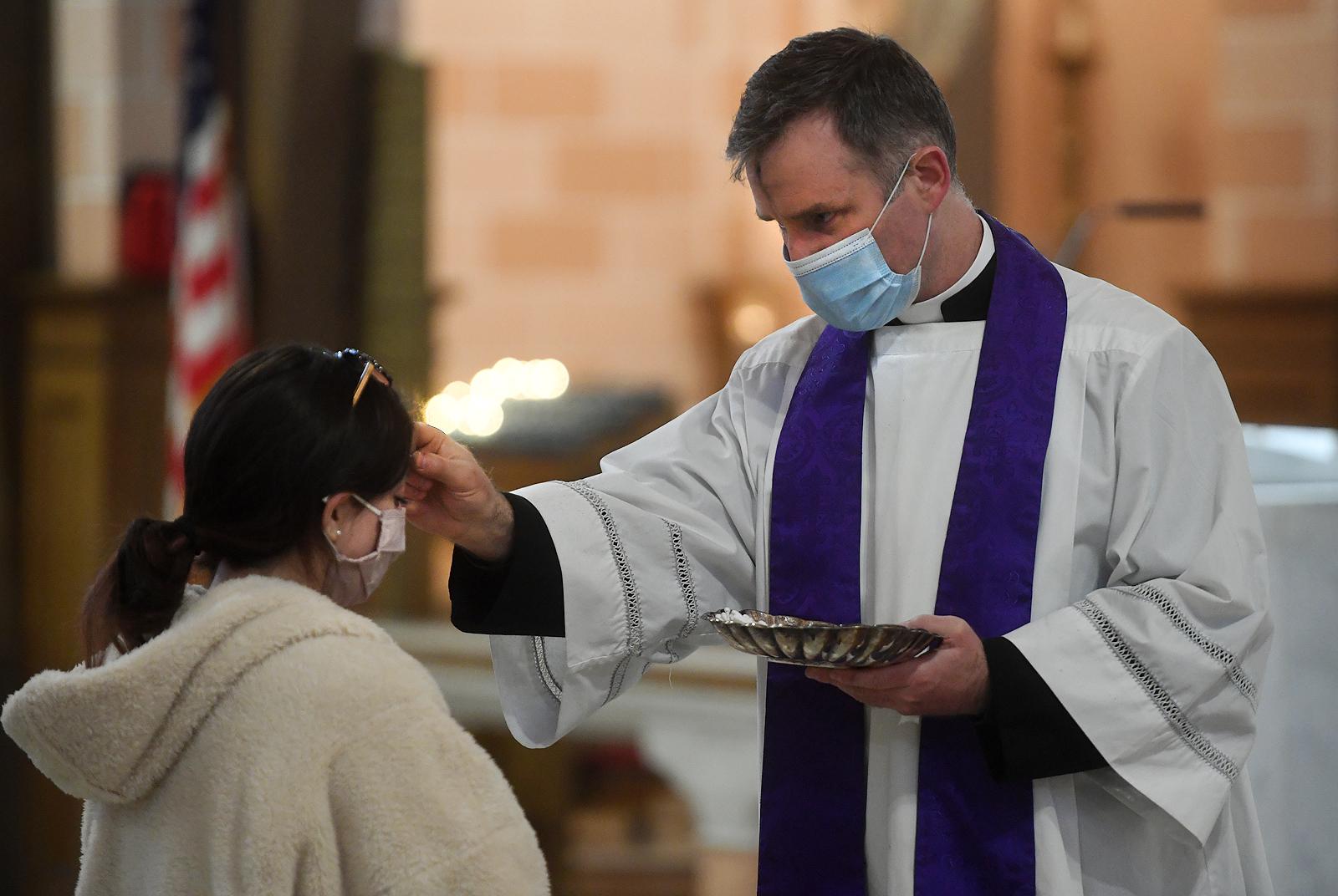 In photos: Ash Wednesday looked a little different this year in ...