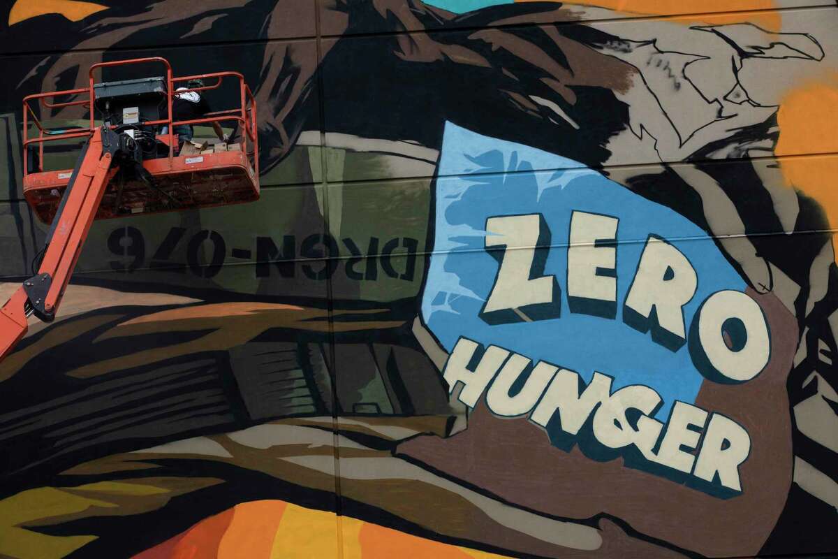 Massive Houston mural is done — and it has a message about hunger