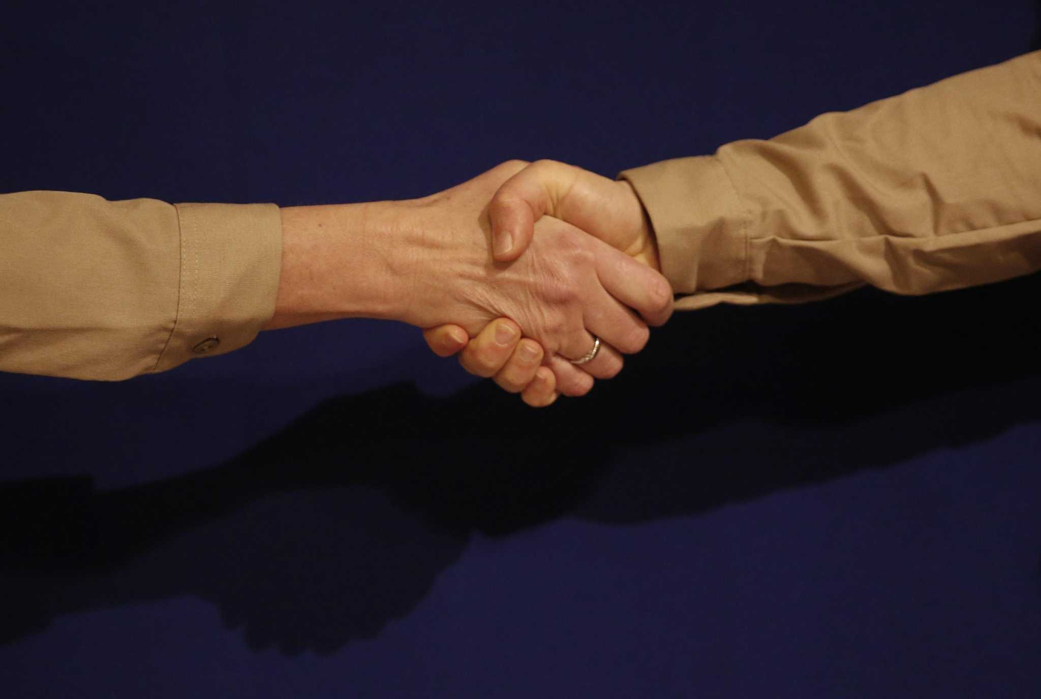 As COVID restrictions ease, are handshakes safe? Not yet, experts say