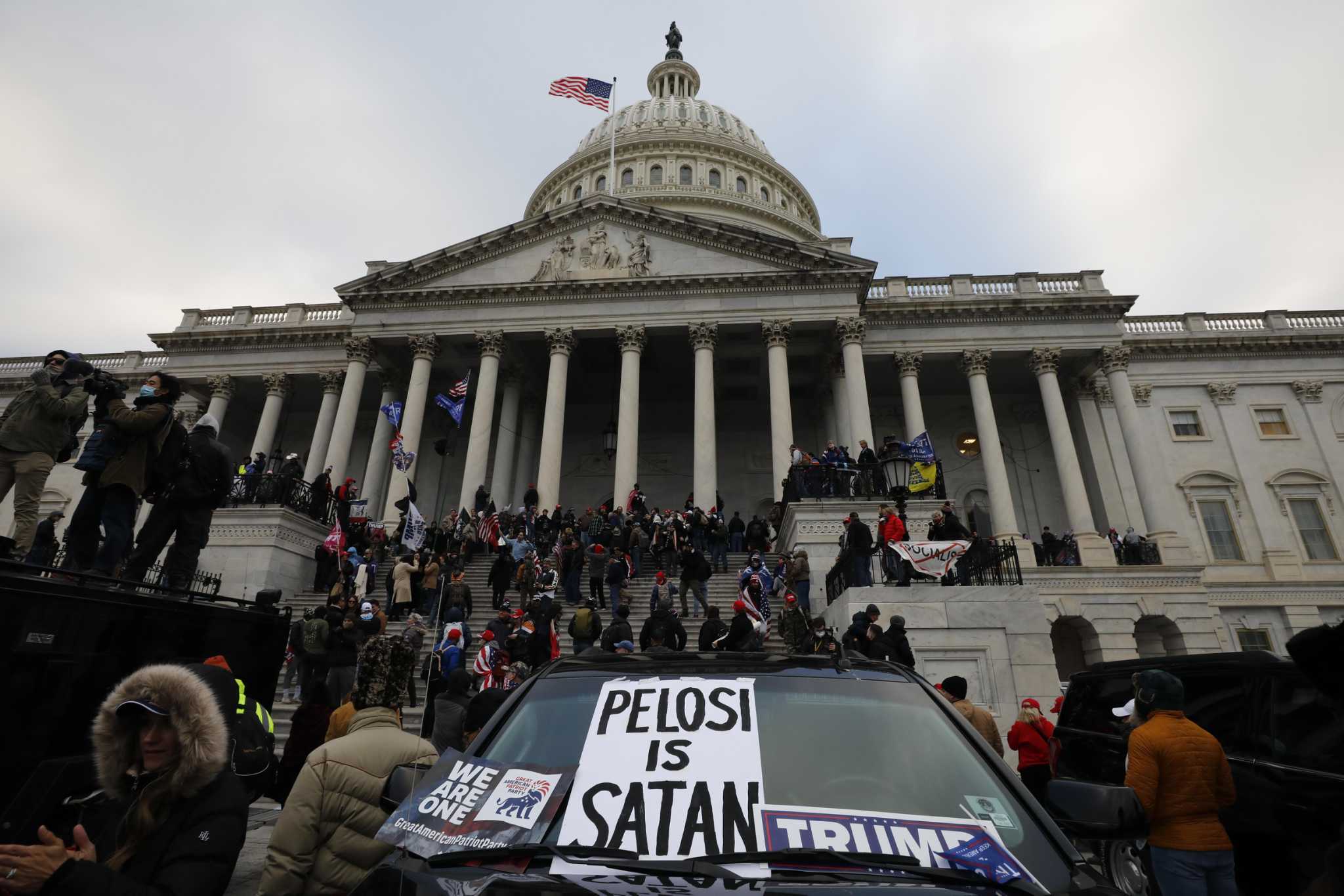 Capitol rioter draped in Confederate flag pleads guilty