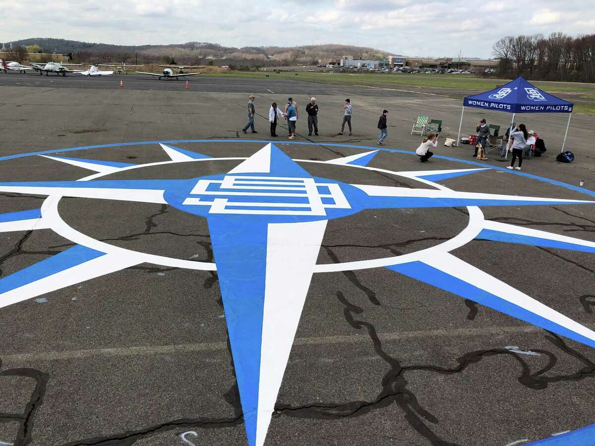 Teen paints compass rose — ‘symbol’ of aviation — at Danbury airport ...