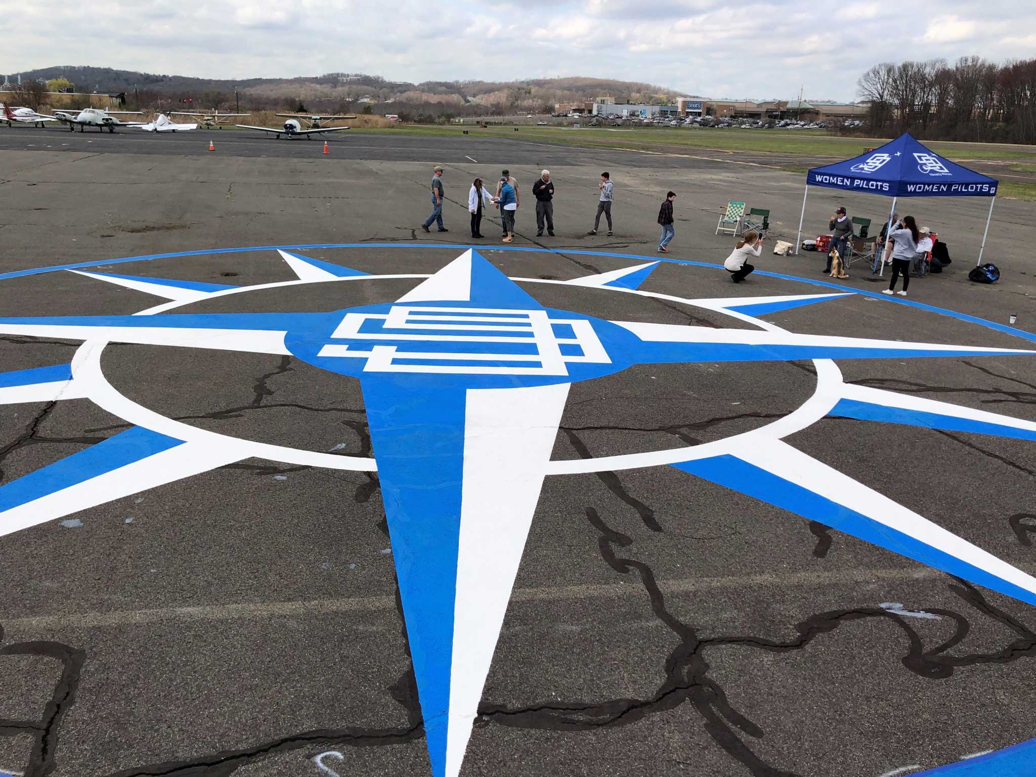 Teen paints compass rose — ‘symbol’ of aviation — at Danbury airport ...