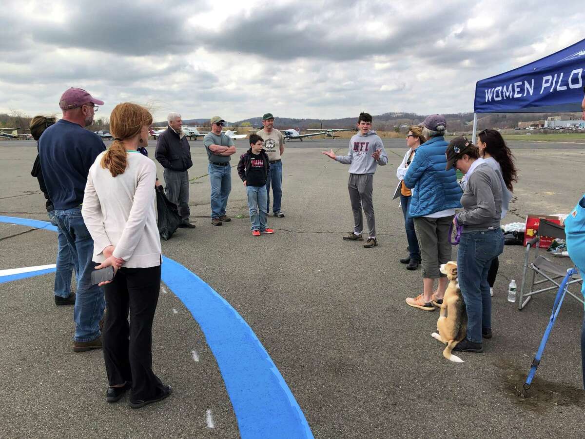Teen paints compass rose — ‘symbol’ of aviation — at Danbury airport ...