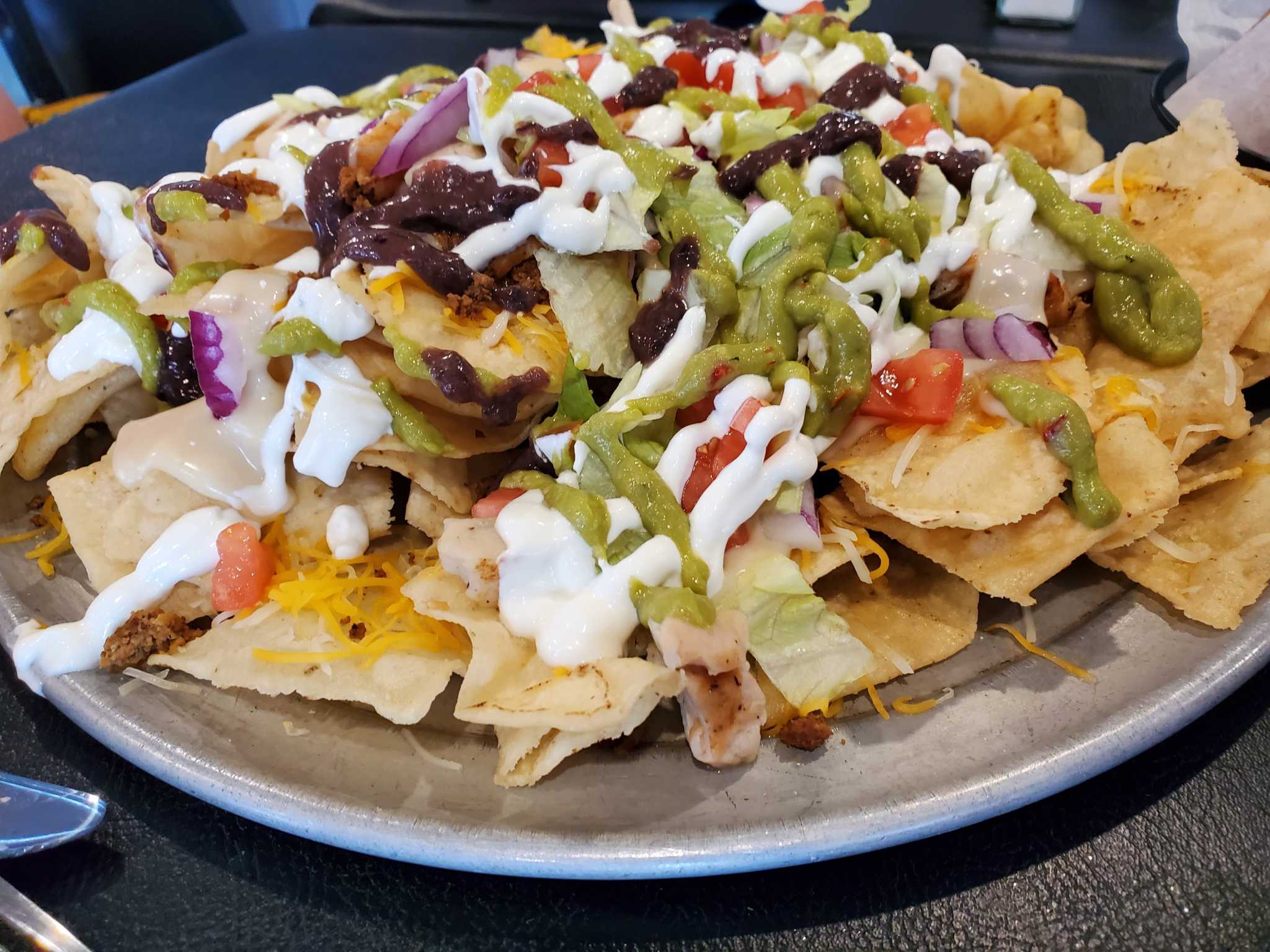 Grabbing nachos and wings at the Bay Port Inn