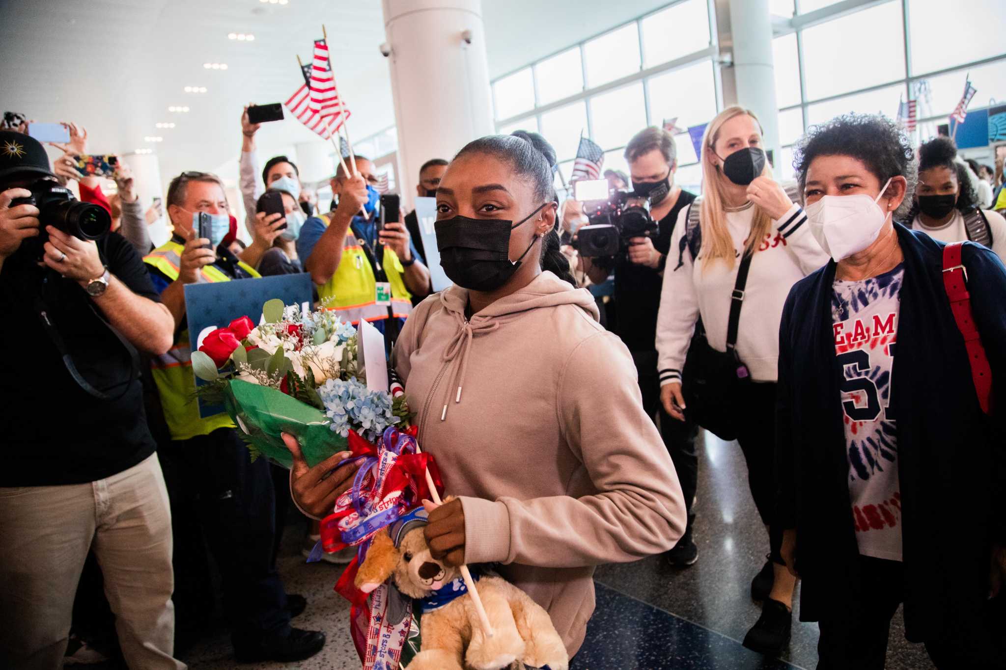 Fans cheer Simone Biles and Jordan Chiles as they return to Houston ...