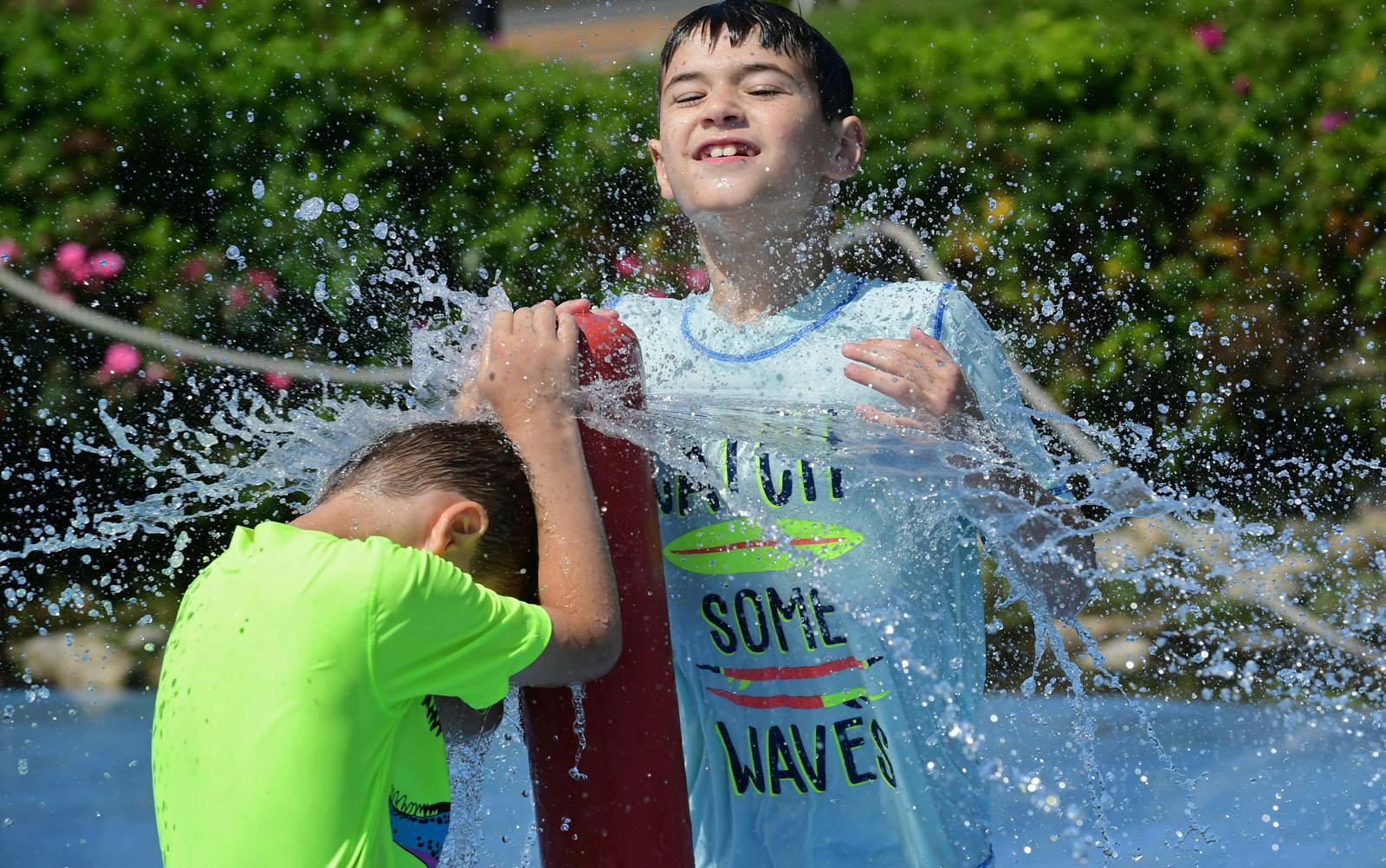 In Photos: Norwalkers beat the heat at Calf Pasture Beach