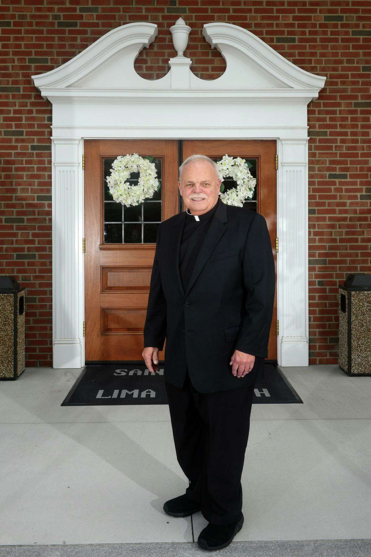 Unwilling to retire at 75, a Newtown priest gets an extension to mark ...