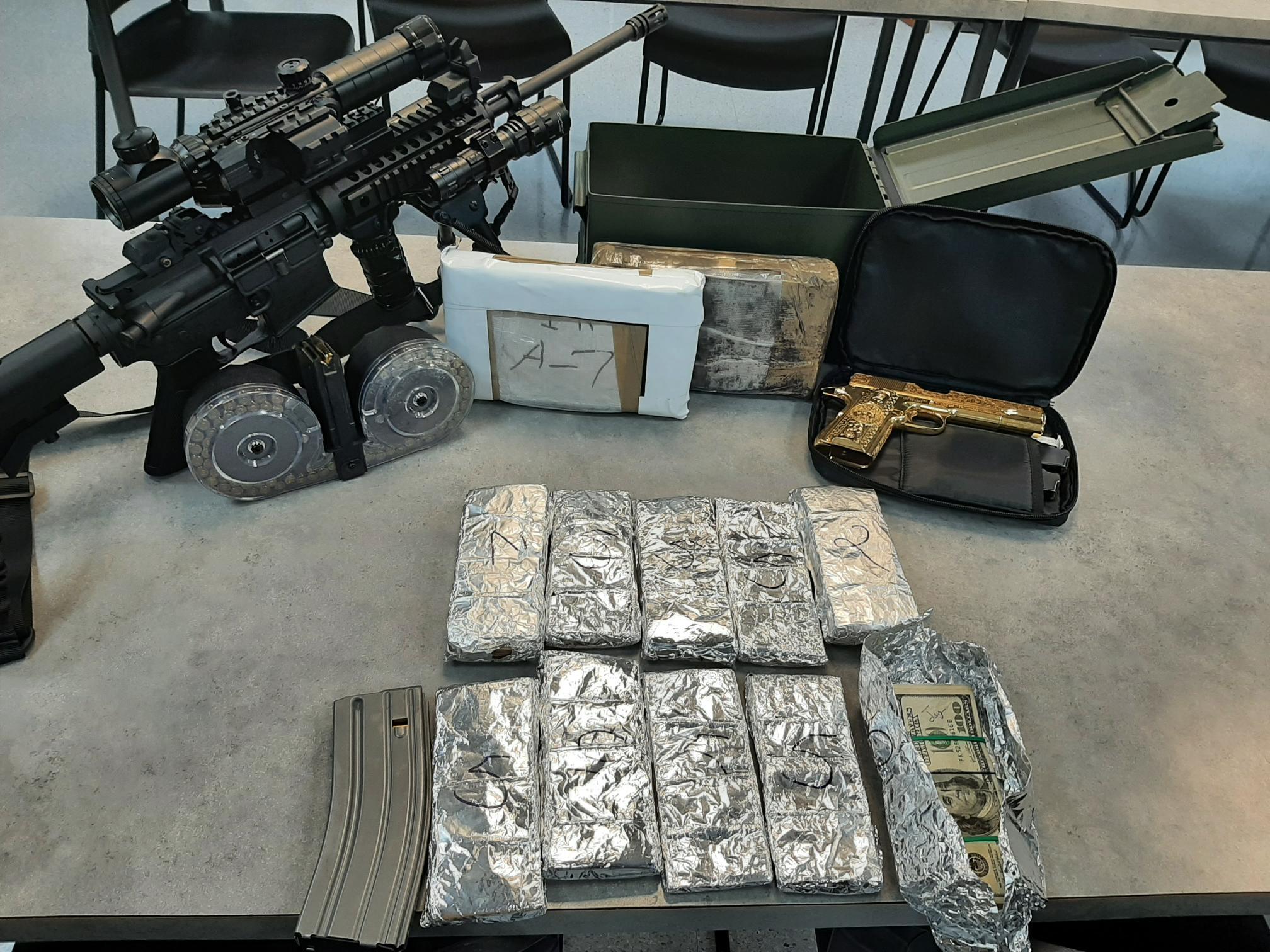 Officials find $44K, gold-plated pistol, rifle and cocaine during bust