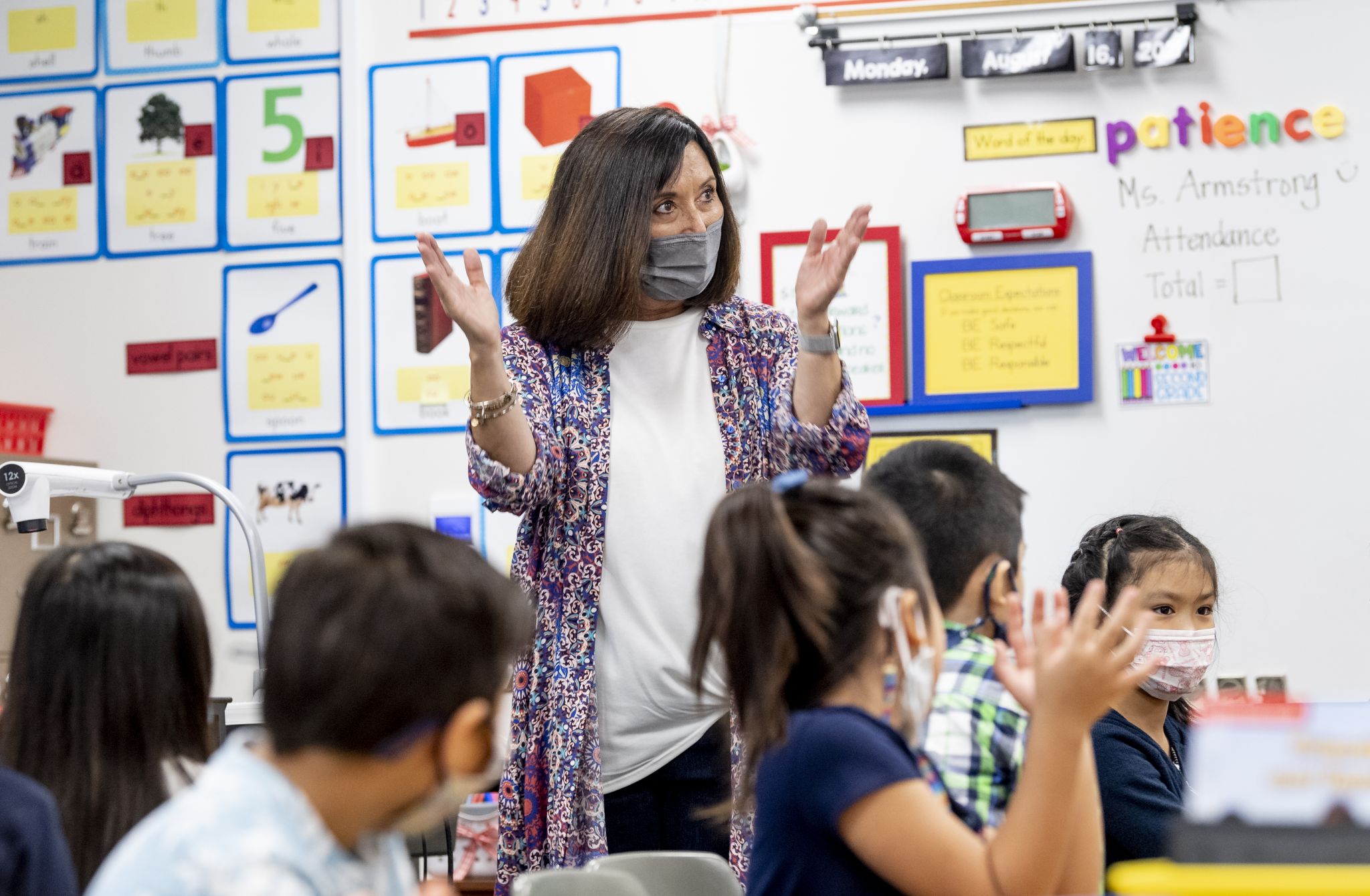 California announces masks will stay on in schools for now