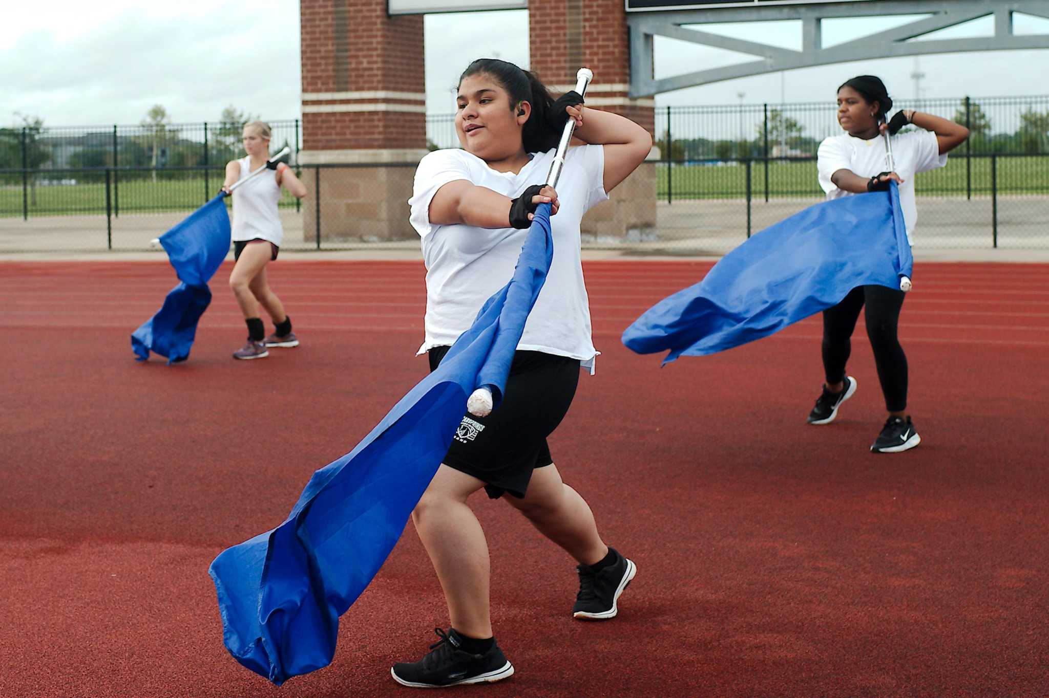 Deaf color guard member excels with a little help from a friend