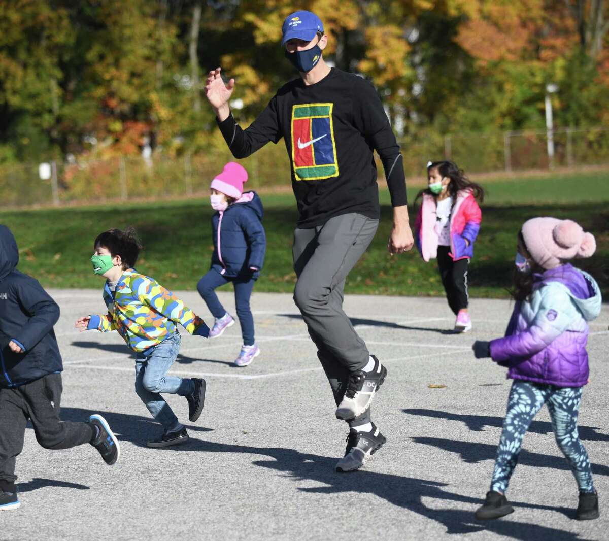 In photos: Tennis anyone? Former pro player teaches Cos Cob kids the ...