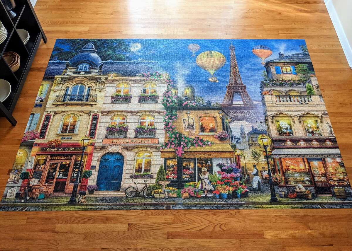 CT family of puzzle enthusiasts complete massive 18,000 piece jigsaw