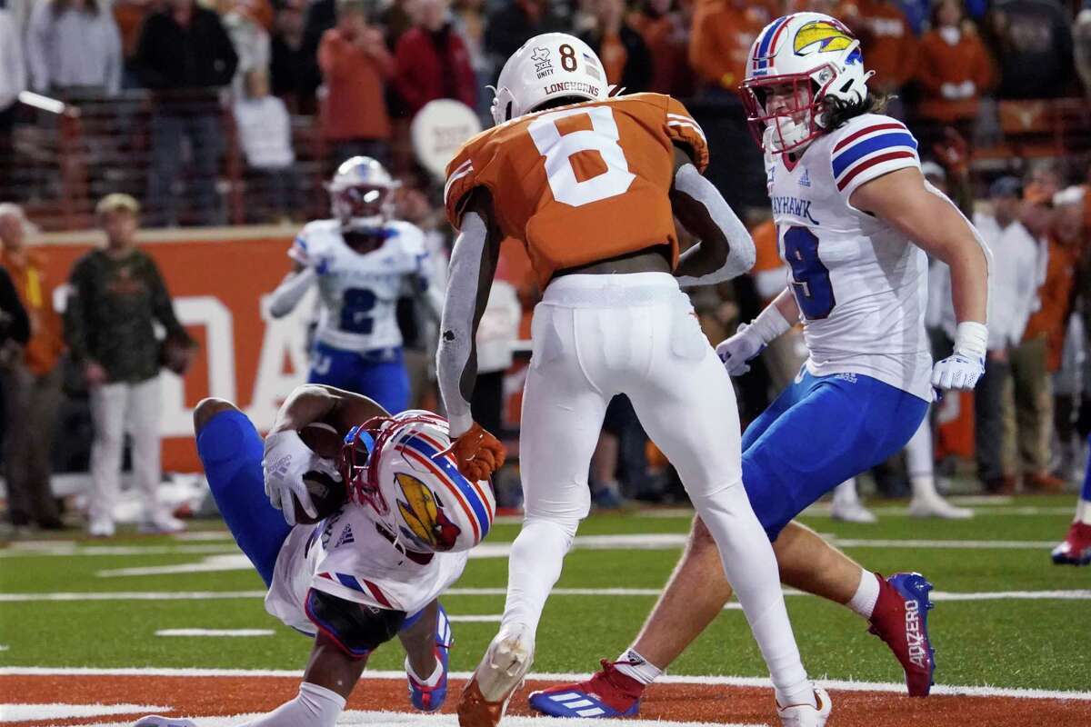 Texas' freefall continues with OT loss to Kansas