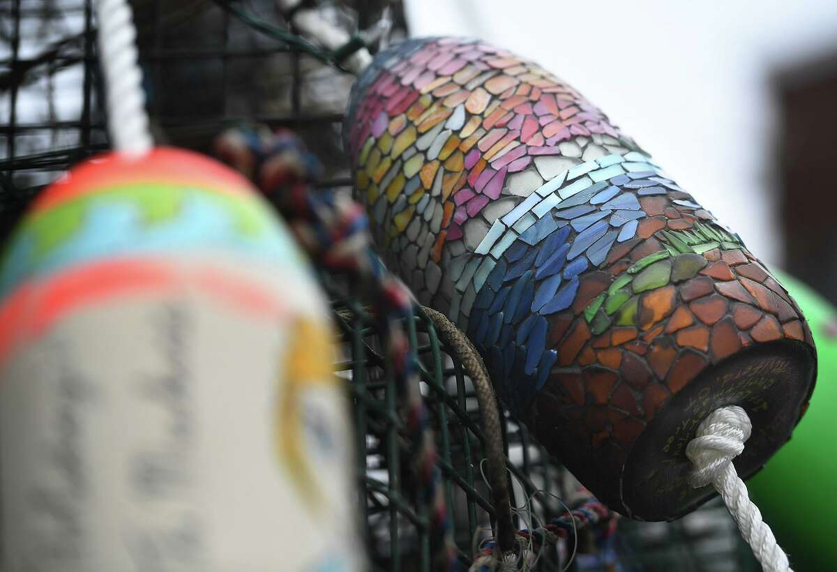 Milford installs first holiday lobster trap, buoy tree