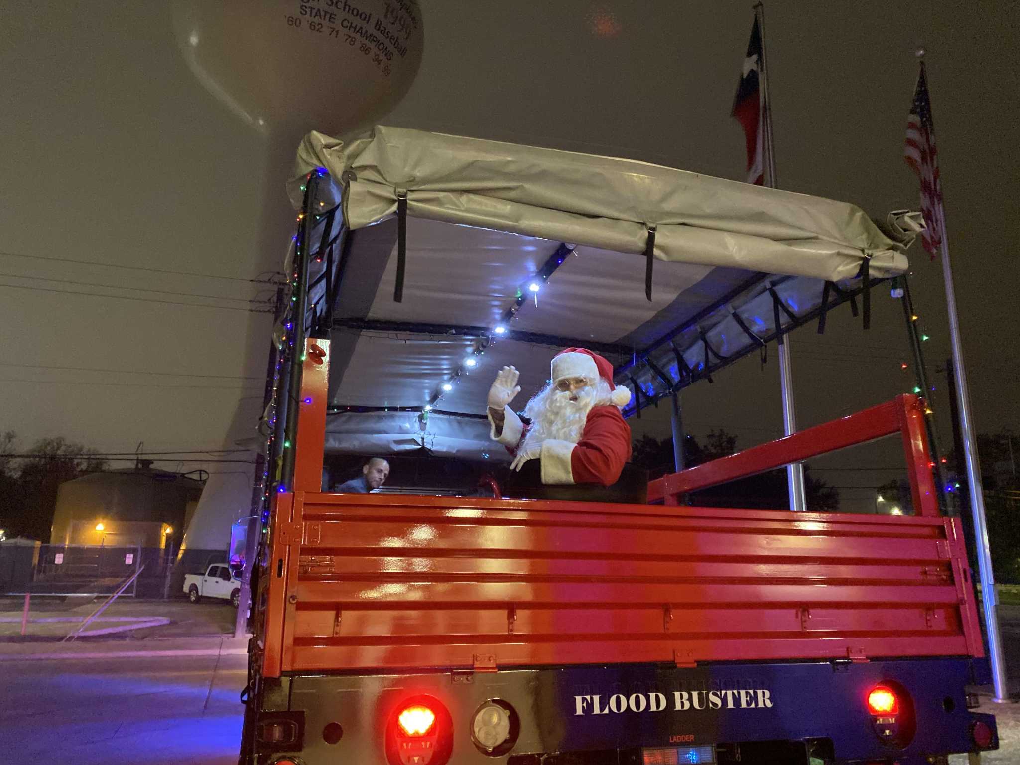 Santa trades sleigh for high water rescue vehicle visit to Bellaire