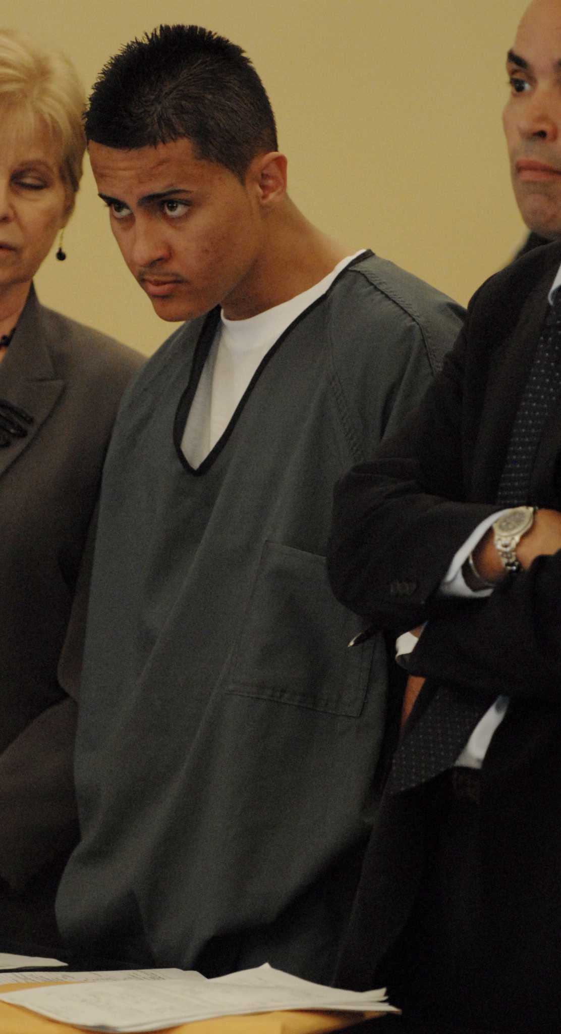 Man convicted of killing Troy football star accused of hitting wife