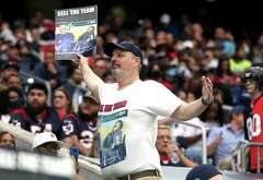 Texans fans bring 'Sell the team' shirts, signs to season finale