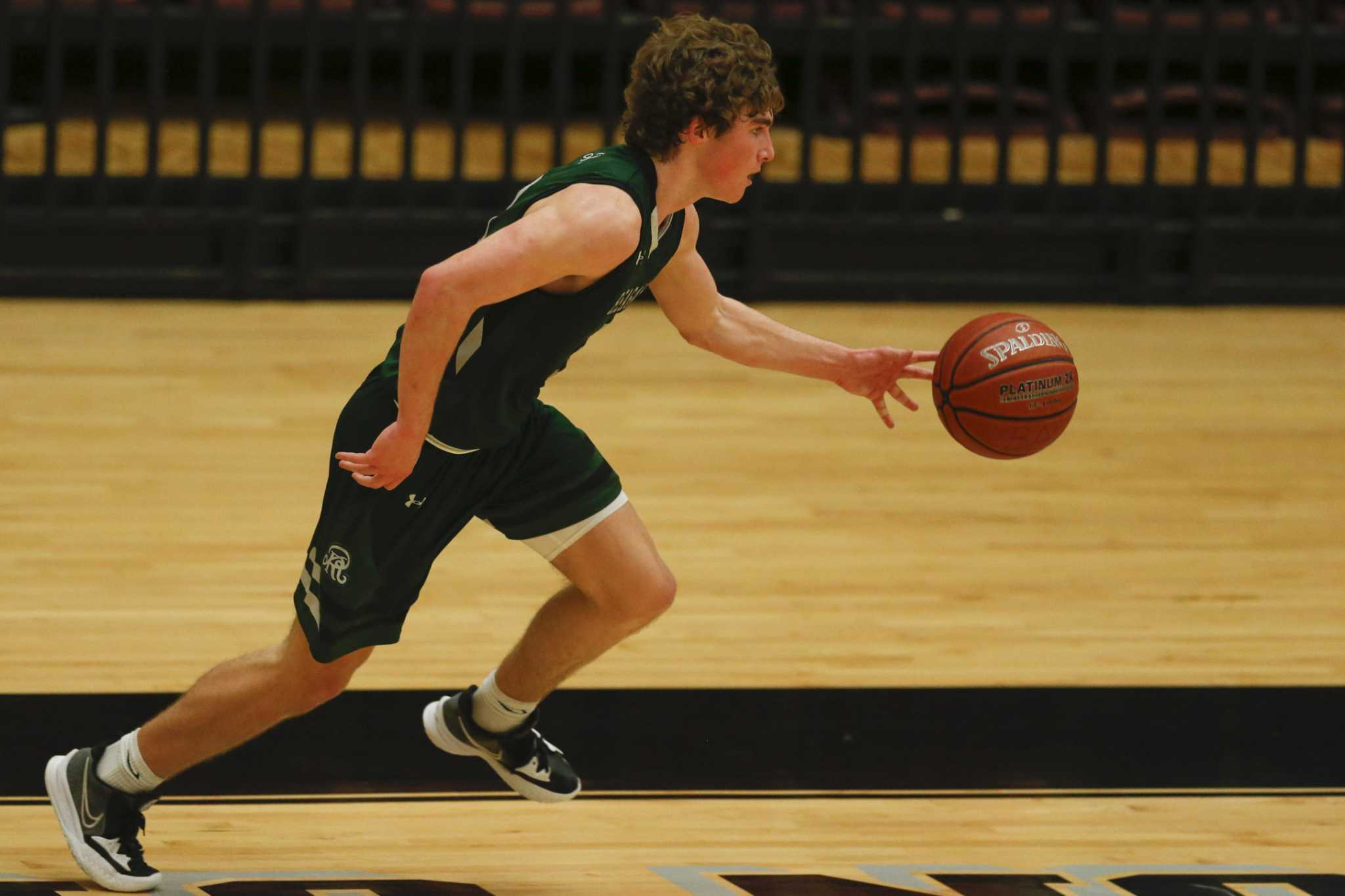Boys basketball: No. 1 Reagan’s balanced offensive effort levels LEE