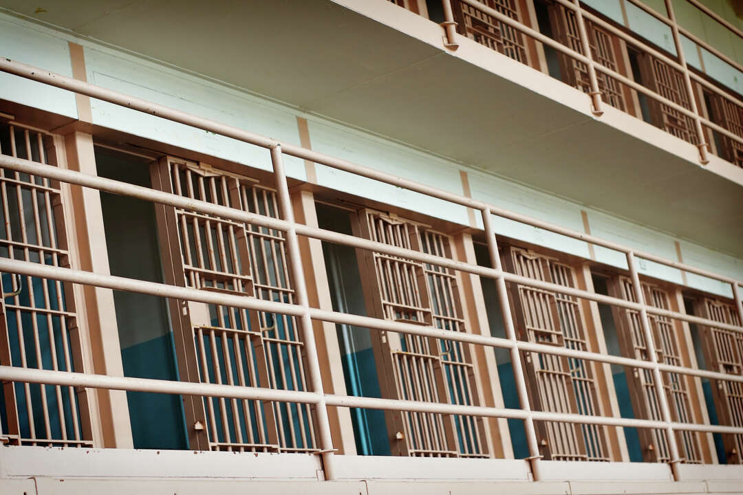 Federal prison system in lockdown after two inmates are killed at ...