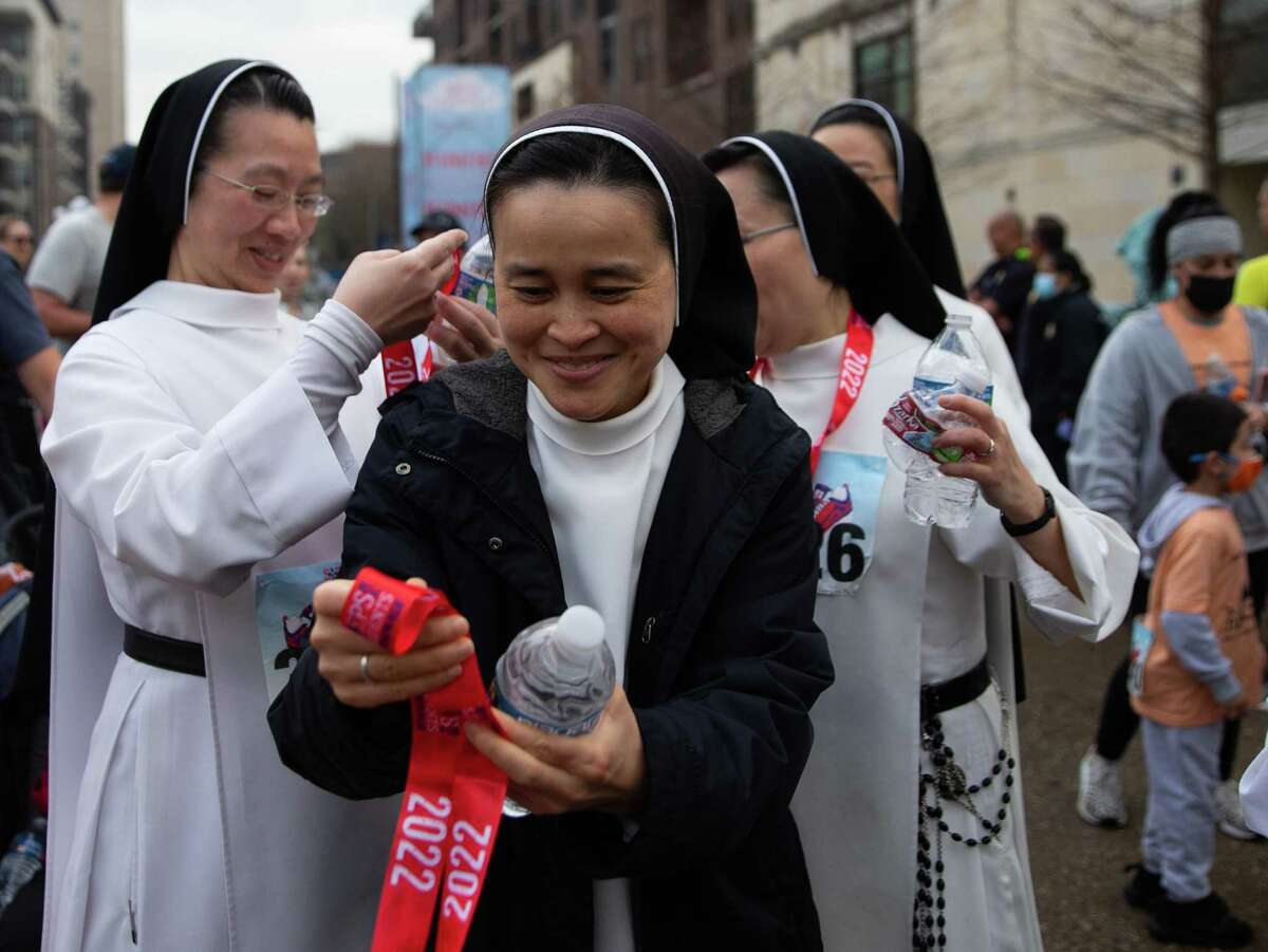 While waiting out MLB lockout, “Rally Nuns” run through downtown ...