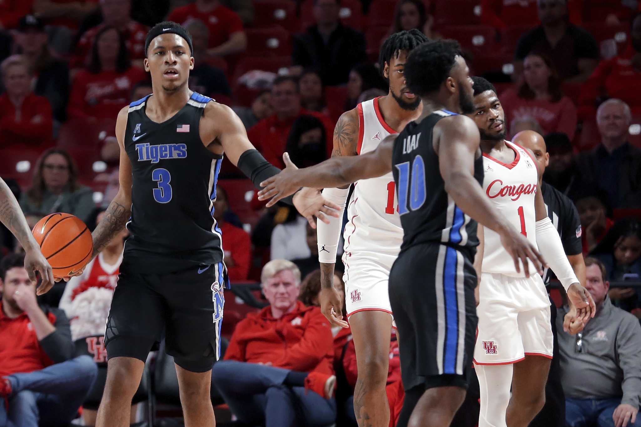 Houston fan holds sign disrespecting deceased Memphis rapper Young Dolph