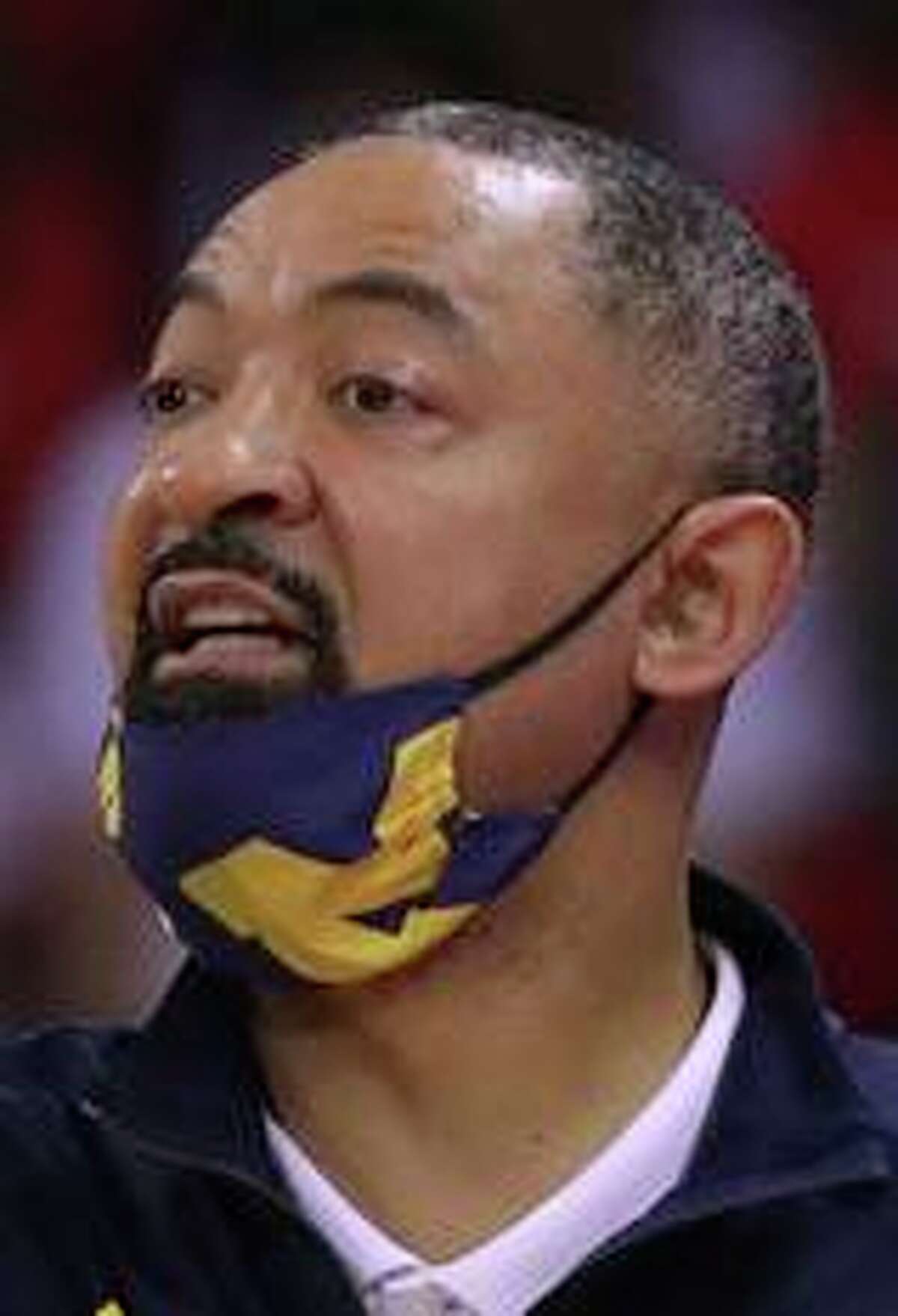 Michigan head coach Juwan Howard hits Wisconsin assistant in head
