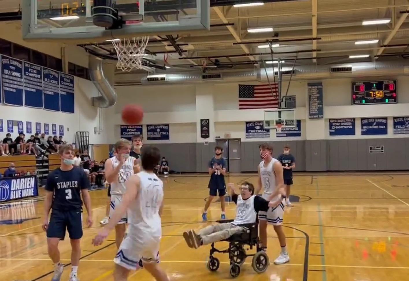 From wheelchair, Darien’s Tripp Lyons gives memorable assist on Senior Night