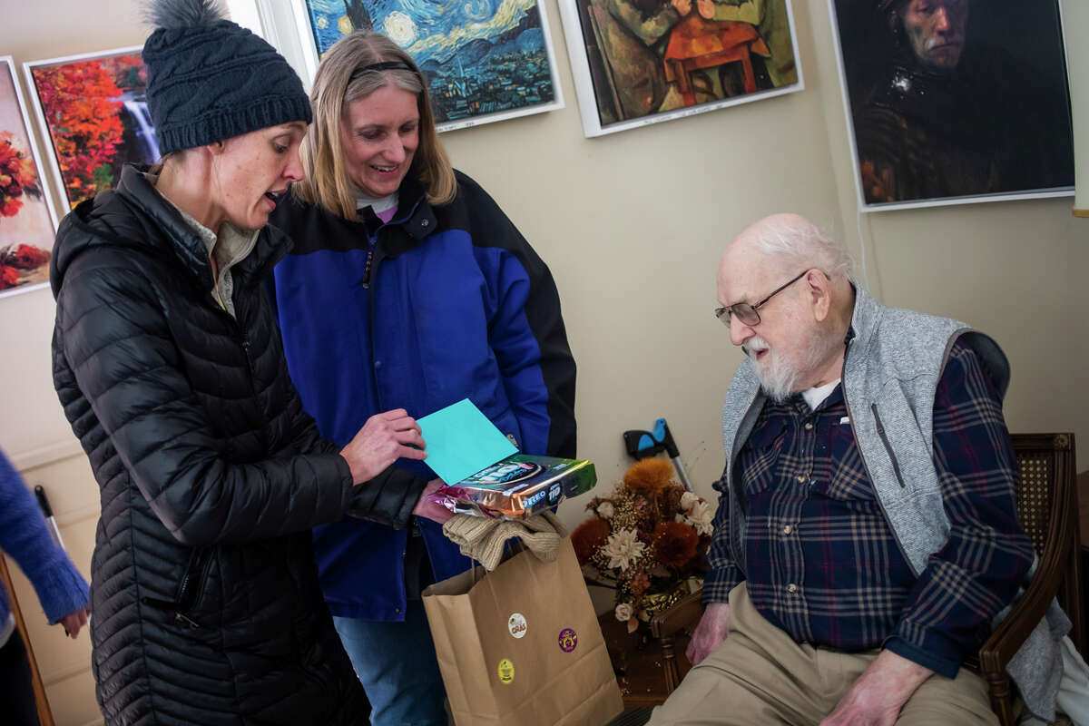 Neighbors surprise Midland resident Frank Scheidt on his 100th birthday