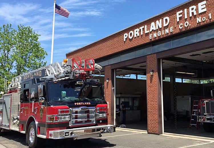 Officials: Family escapes two-alarm Portland house fire
