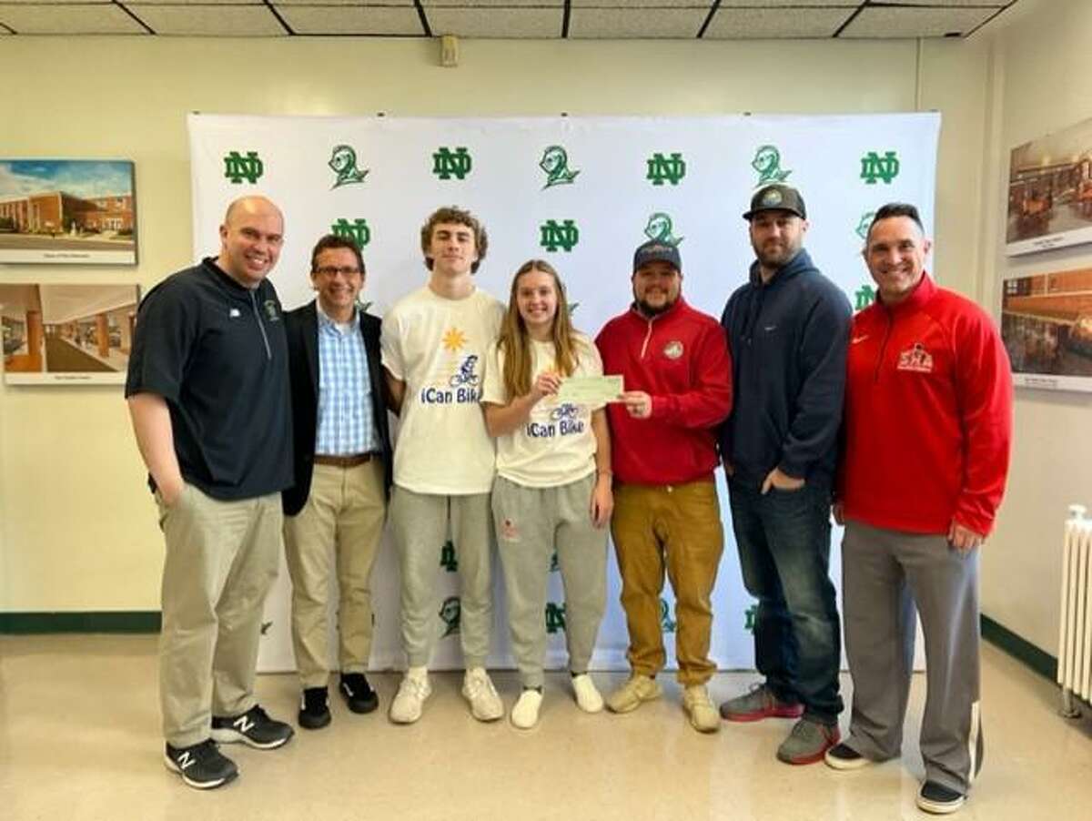 High school teams join forces for Milford Recreation donation