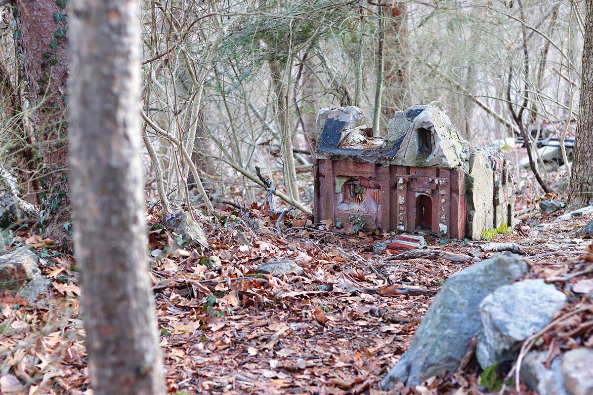 The truth behind a mysterious "fairy" village in the woods along I-84