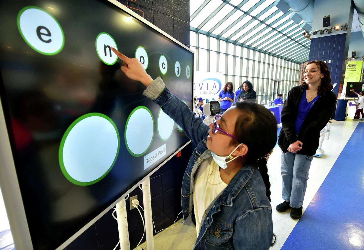 Photos: Bridgeport students get robot gift for World Autism Day