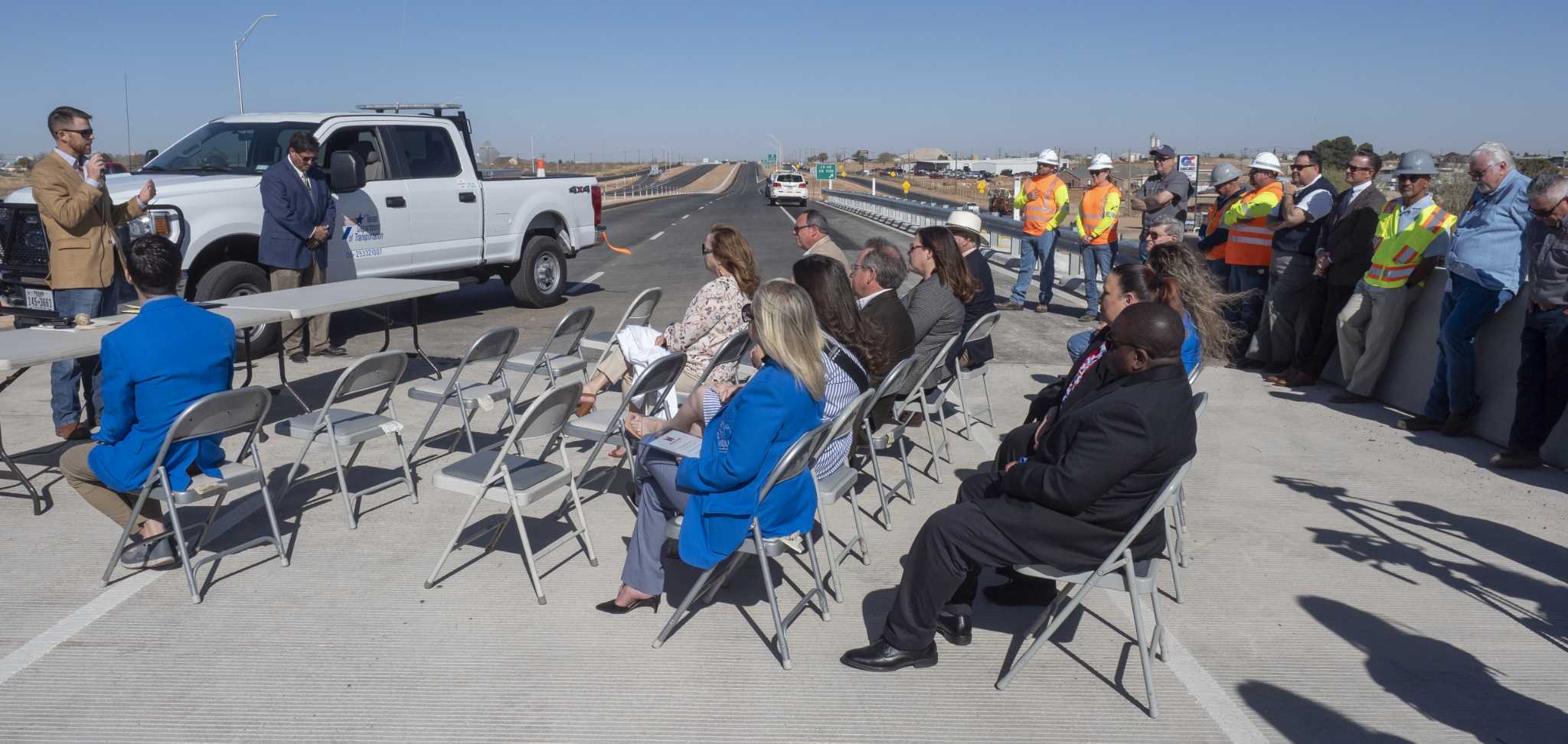 Officials celebrate the completion of another Loop 250 overpass