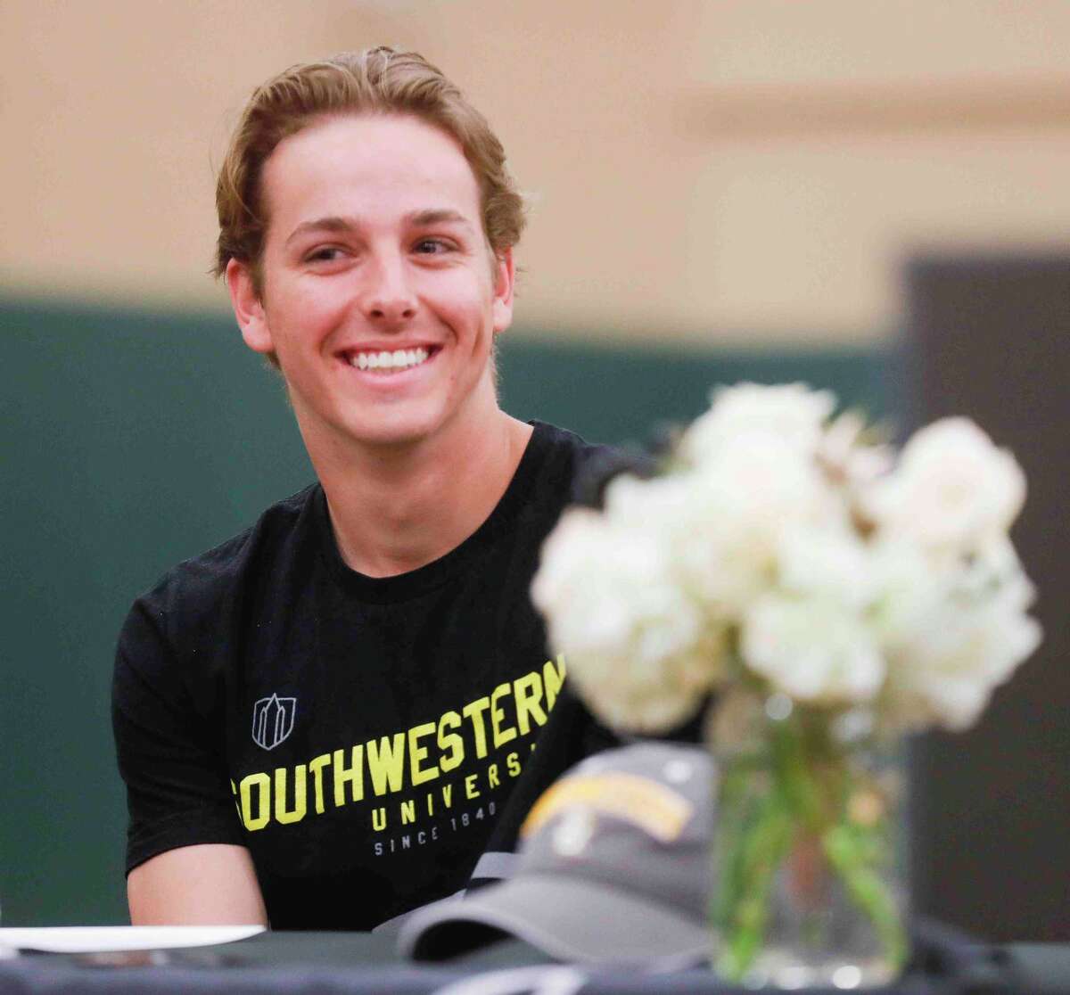 John Cooper football players receive SPC championship rings at signing day
