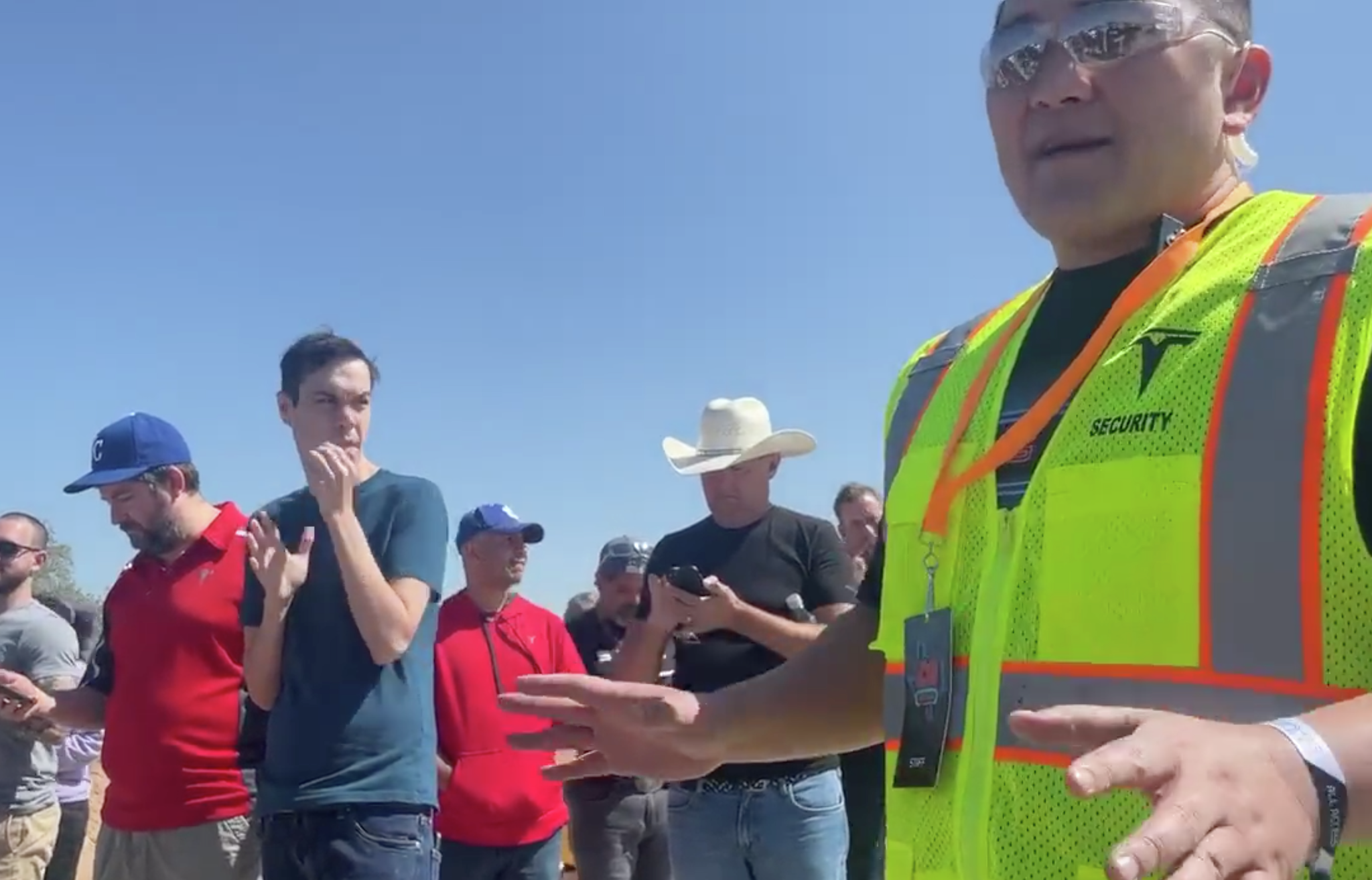 Upset Tesla fans told to disperse after trying to gain entry to Elon ...