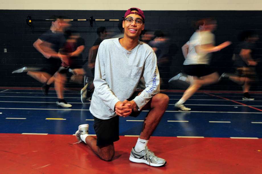 Staples’ Chet Ellis jumping over the competition