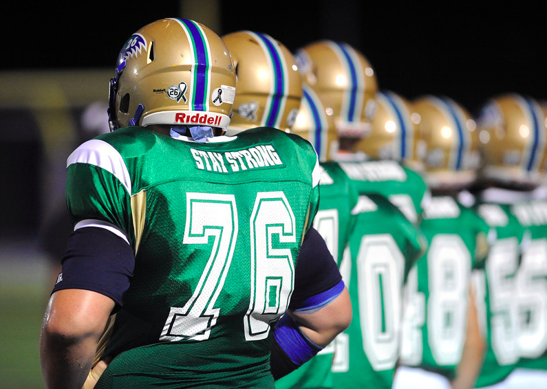 Adorned in Sandy Hook colors, Newtown football hangs on to defeat Bethel